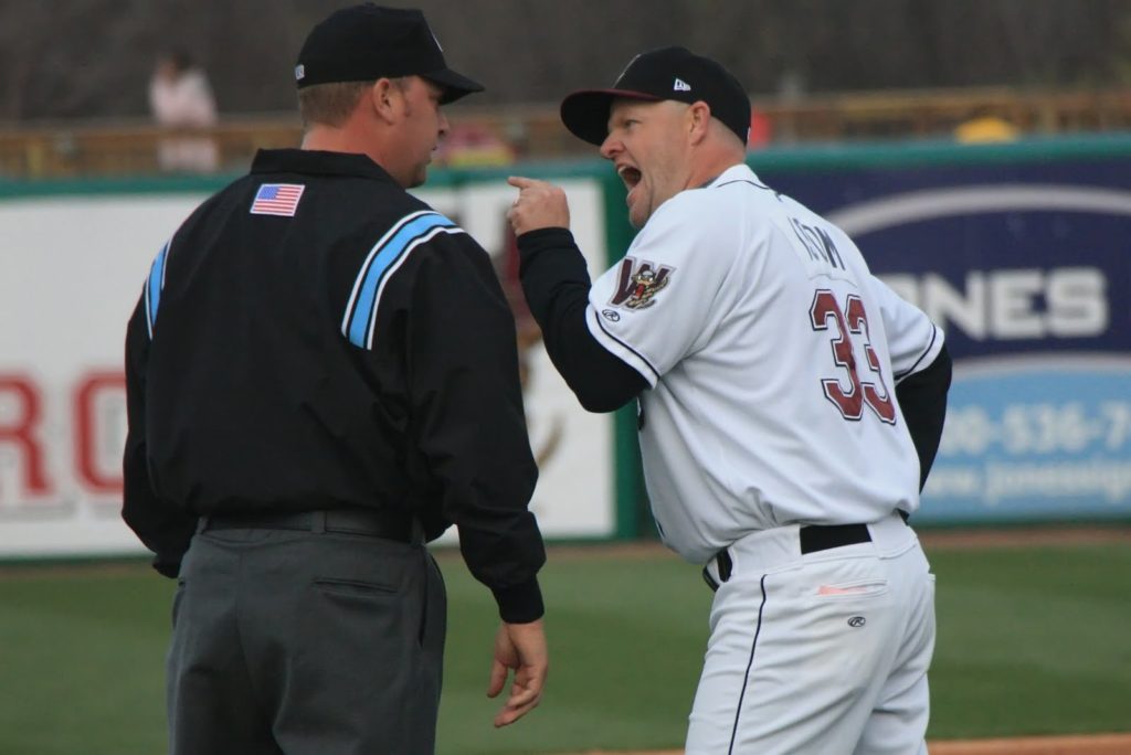 Jeff_Isom_arguing_with_an_umpire | Athena Executive Education Inc.